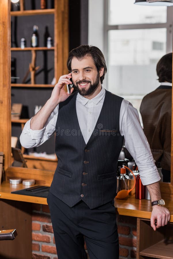 Handsome Young Barber Talking by Phone Stock Photo - Image of ...