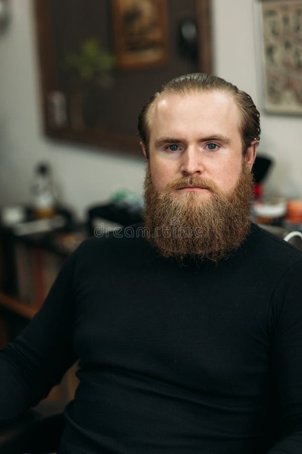 Handsome Young Bearded Guy Sitting In An Armchair In A Beauty Salon ... Handsome Young Bearded Guy Sitting In An Armchair In A Beauty Salon ...