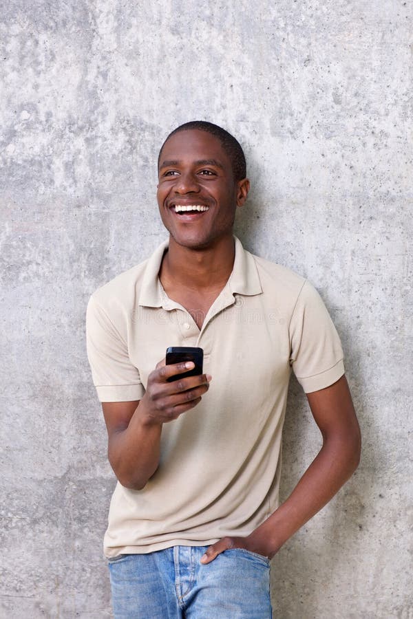 Handsome Young Black Guy Laughing with Mobile Phone Stock Image - Image ...
