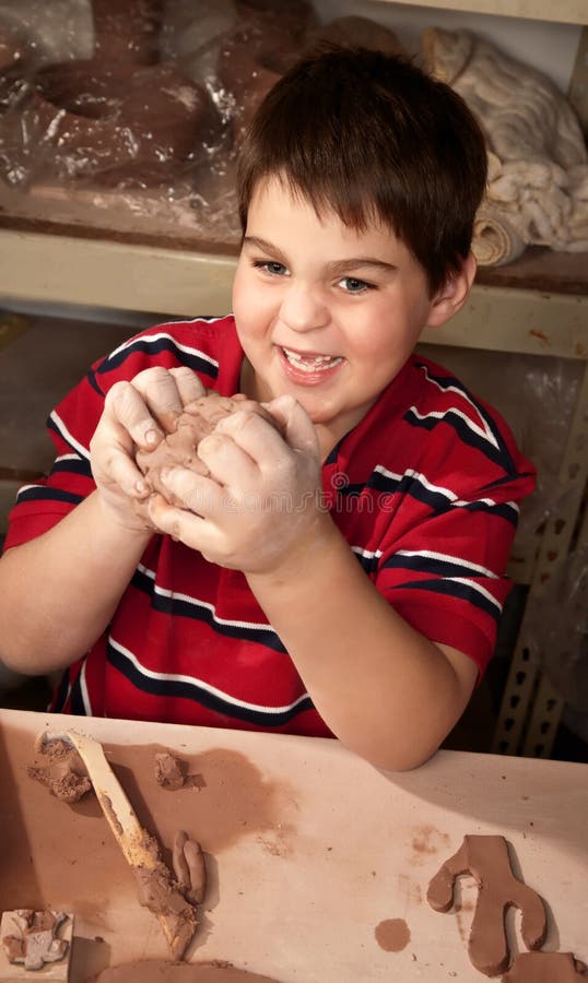 Children in a clay studio stock image. Image of messy - 13348303