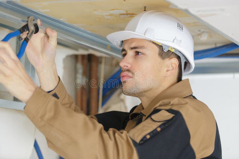 Handsome Young Builder Fixing Problem Stock Photo - Image of closeup ...