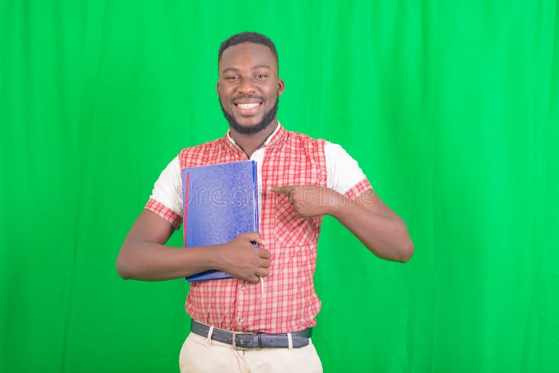 Handsome Young Business Man Pointing Finger at Note Book Smiling Stock ...