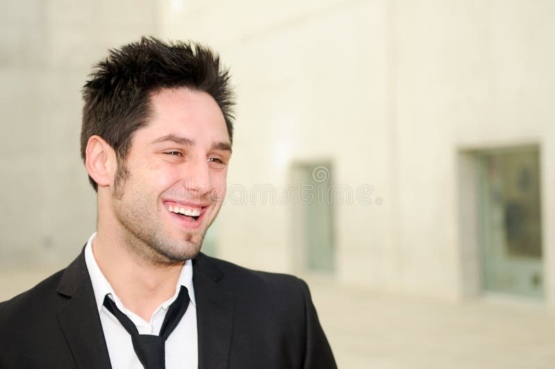 Handsome Young Business Man Smiling Stock Photo - Image of leaning ...