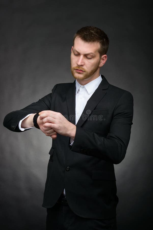 Handsome Young Businessman Looking at Watch Stock Photo - Image of ...