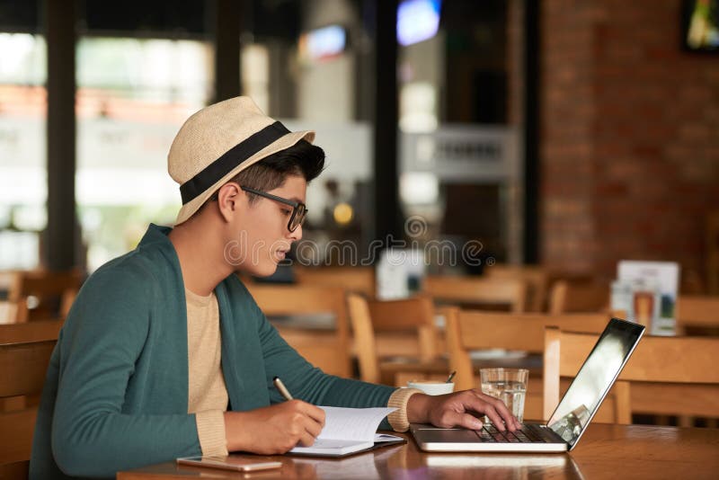 Young man busy with work stock image. Image of online - 126073101