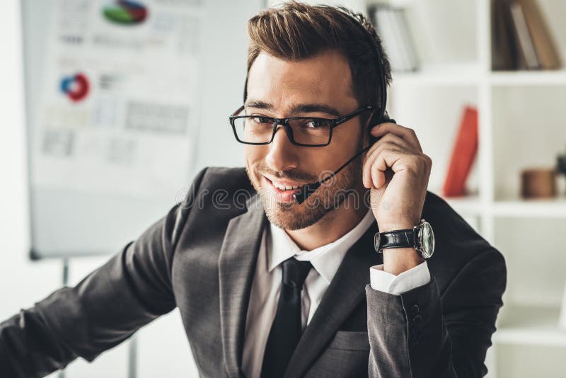 Handsome Young Call Center Worker Looking Stock Photo - Image of camera ...