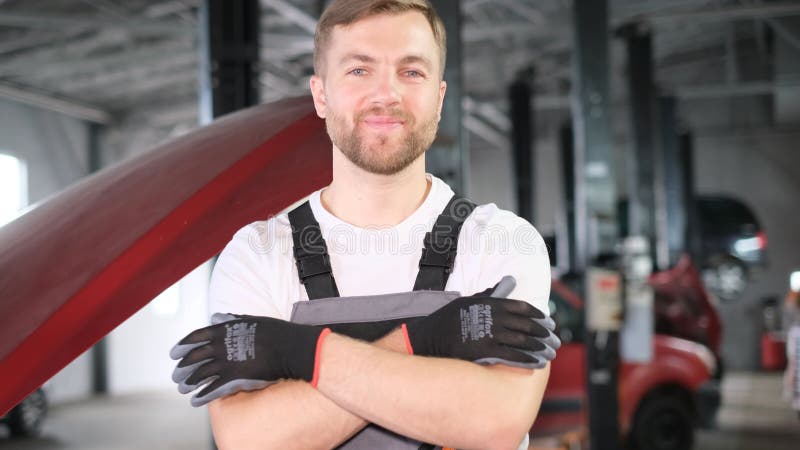Handsome Young Car Mechanic in Uniform Looking at Camera and Smiling ...