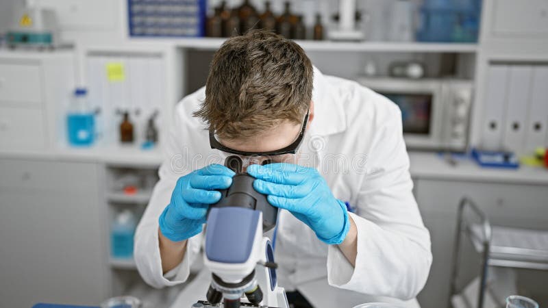 Handsome Young Caucasian Man, a Dedicated Scientist, Deeply Engrossed ...