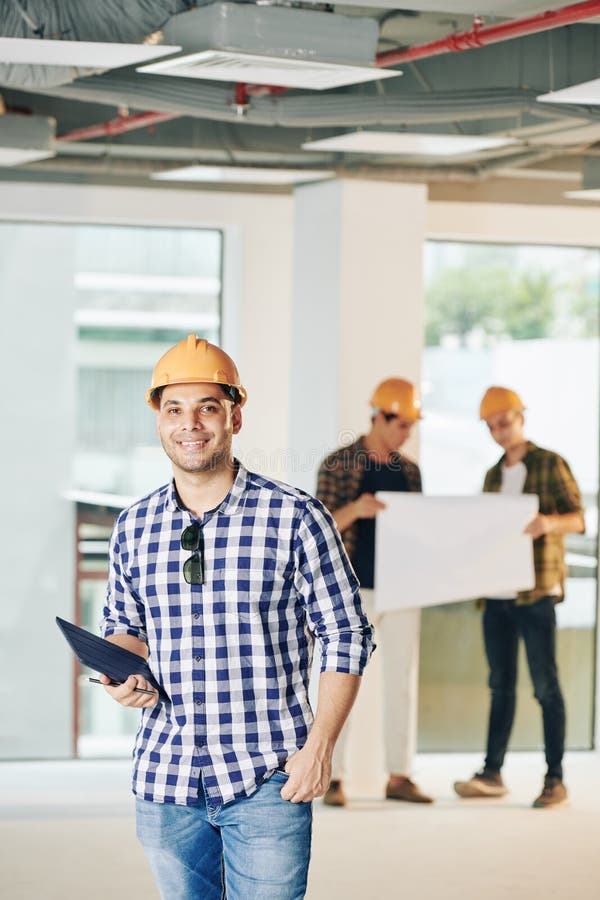 Handsome young contractor stock image. Image of industry - 192403679