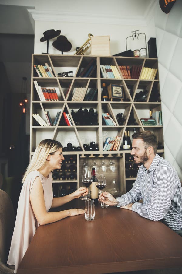 Handsome Young Couple on the Date Sitting at the Table Stock Photo ...