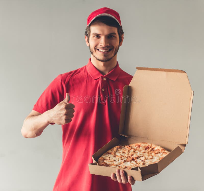 Handsome Young Delivery Worker Stock Image - Image of friendly, looking ...