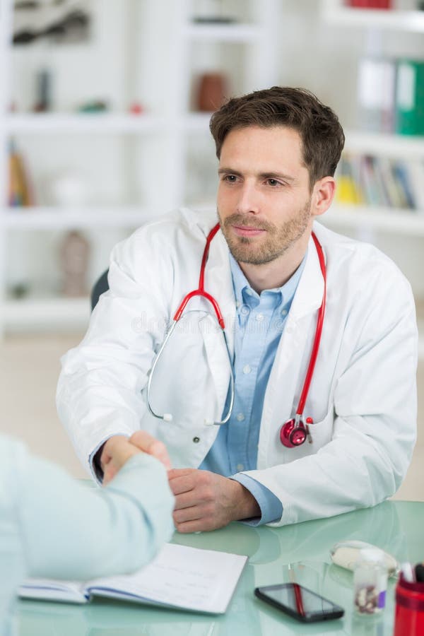 Handsome Young Doctor at Work in Office Stock Photo - Image of ...
