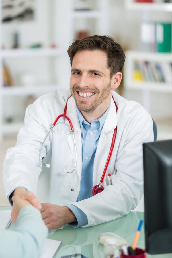 Handsome Young Doctor at Work in Office Stock Image - Image of exam ...