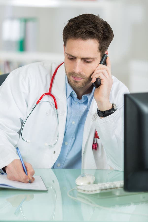 Handsome Young Doctor at Work in Office Stock Image - Image of latin ...