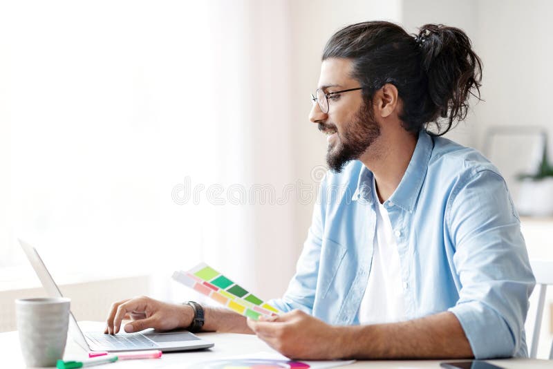 Young Eastern Interior Designer Holding Color Swatch Samples Working ...