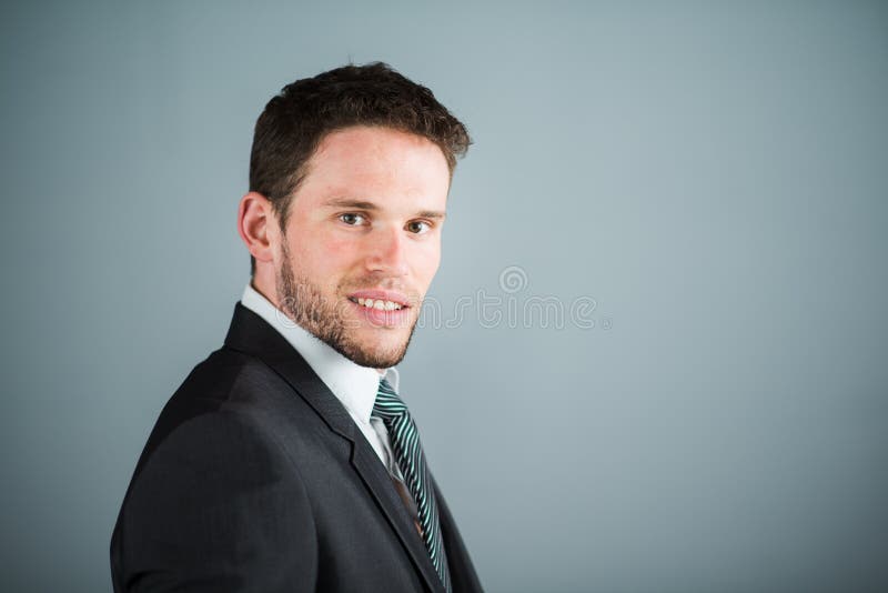 Handsome Young Executive Business Man Isolated on Grey Background Stock ...