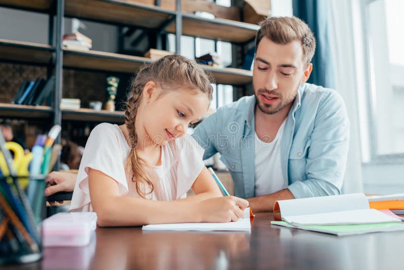 Handsome Young Father Doing Homework Stock Photo - Image of parenthood ...
