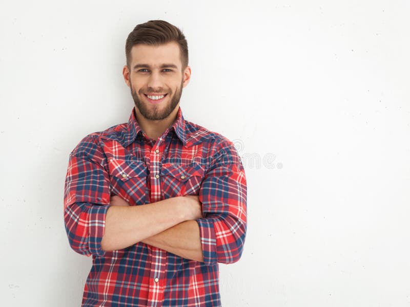 Handsome Young Guy Standing Against White Wall. Stock Photo - Image of ...