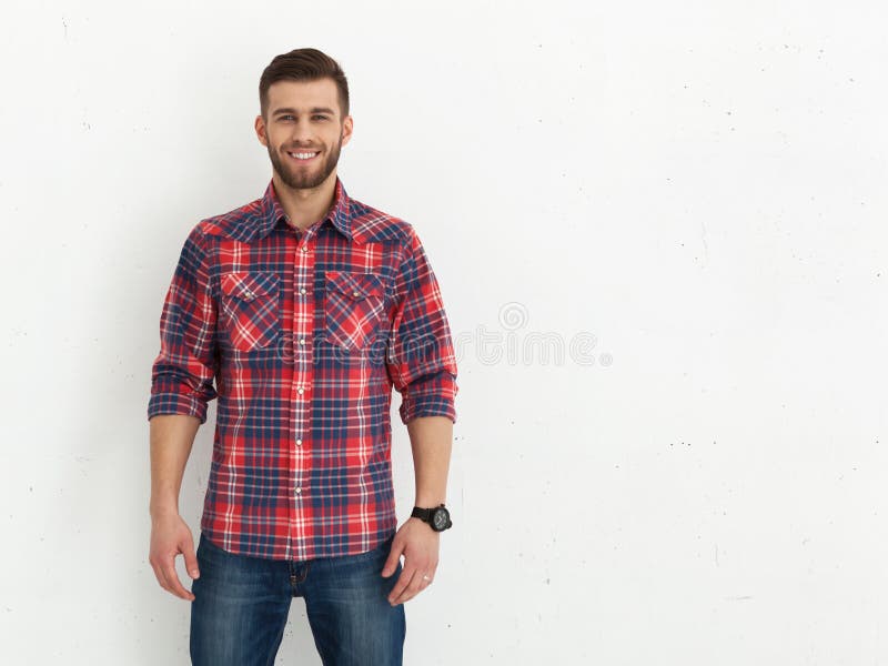 Handsome Young Guy Standing Against White Wall. Stock Photo - Image of ...