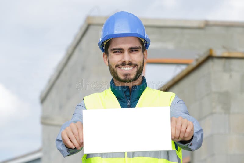 Handsome Young Happy Builder Showing Banner Stock Image - Image of ...