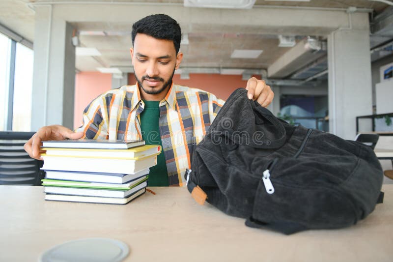 Handsome Young Indian Boy Student with Books and Backpack at University ...