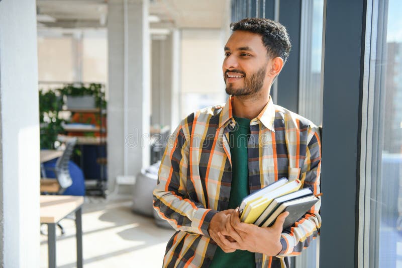 Handsome Young Indian Boy Student with Books and Backpack at University ...
