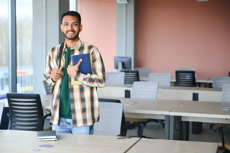Handsome Young Indian Boy Student with Books and Backpack at University ...