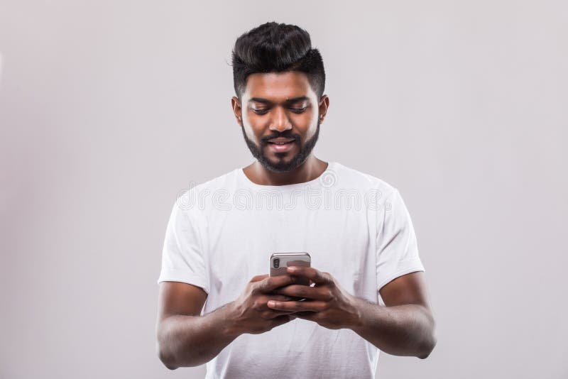 Handsome Young Indian Man Using Mobile Phone Isolated on White ...