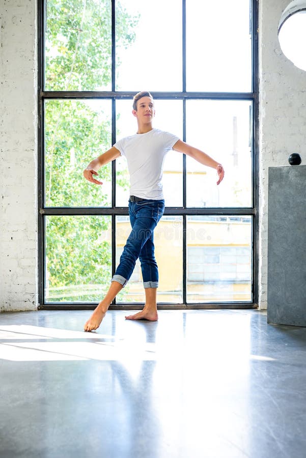A Handsome Young Male Ballet Dancer Practicing in a Loft Style a Stock ...