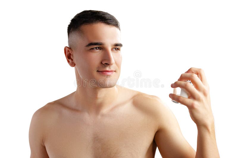 Handsome Young Man Applying Perfume on White Background Stock Photo ...