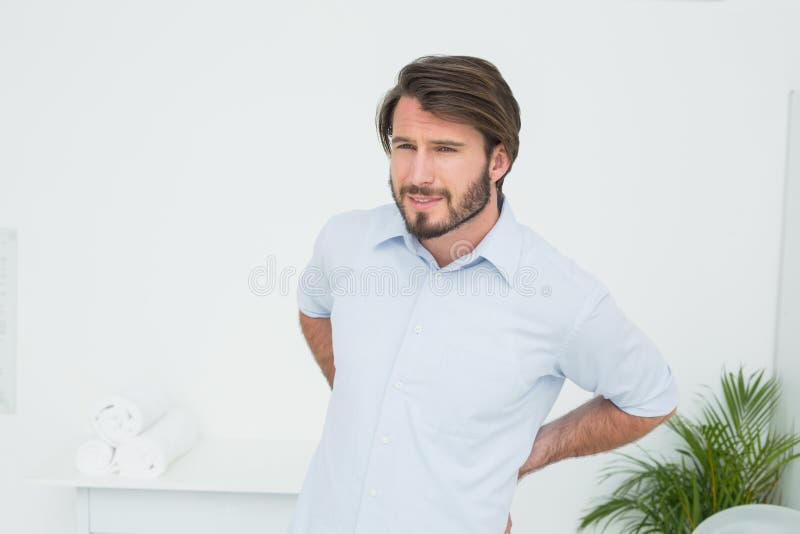 Handsome Young Man with Back Pain Stock Photo - Image of massage ...