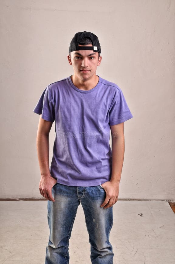 Handsome Young Man with Backwards Cap on His Head Posing in Stud Stock ...