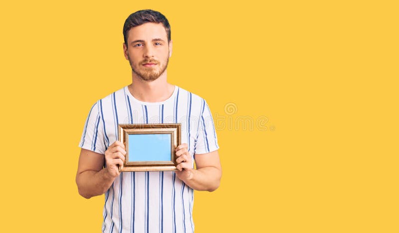Handsome Young Man with Bear Holding Empty Frame Thinking Attitude and ...