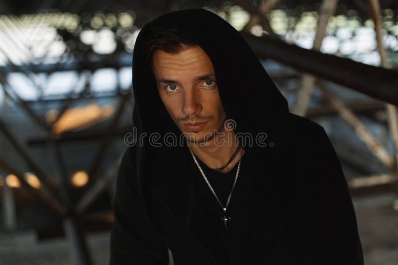 Handsome Young Man in a Black Robe with a Hood Stock Photo - Image of ...
