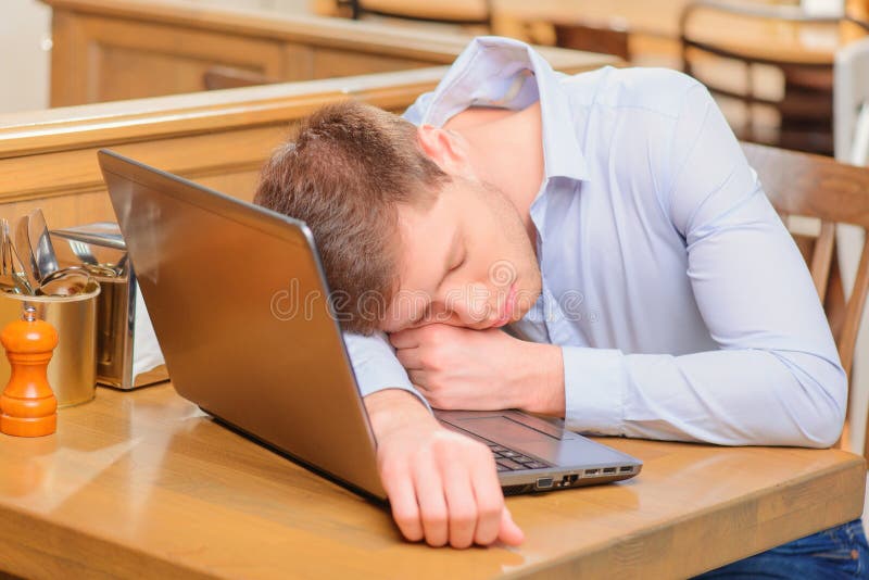 Handsome young man in cafe stock image. Image of research - 50478115