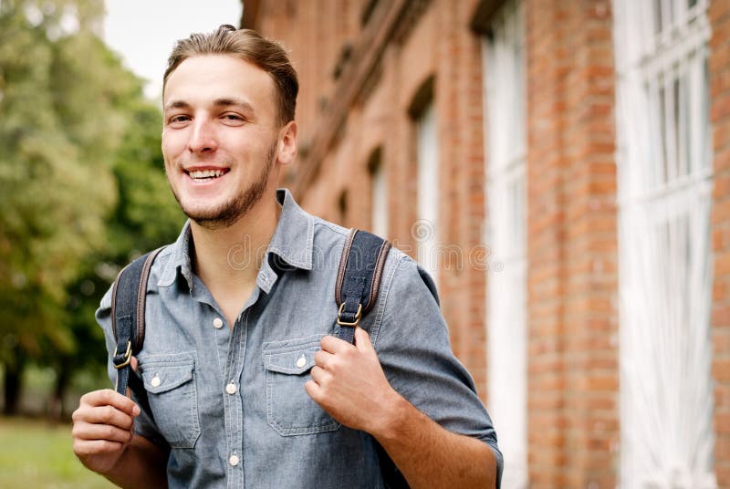 Handsome Young Man Carrying a Backpack Stock Image - Image of adult ...
