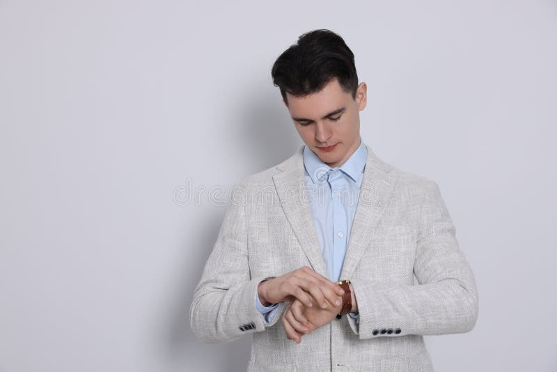 Handsome Young Man Checking Watch on His Wrist Stock Photo - Image of ...