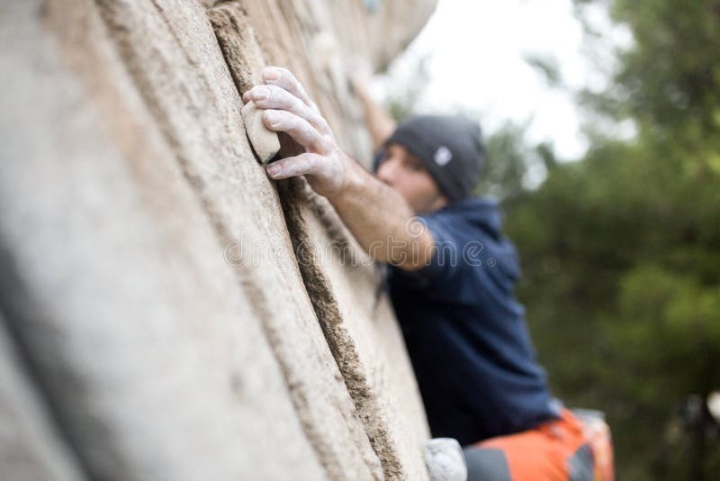 Handsome Young Man Climbing Natural Rocky Wall. Stock Photo - Image of ...