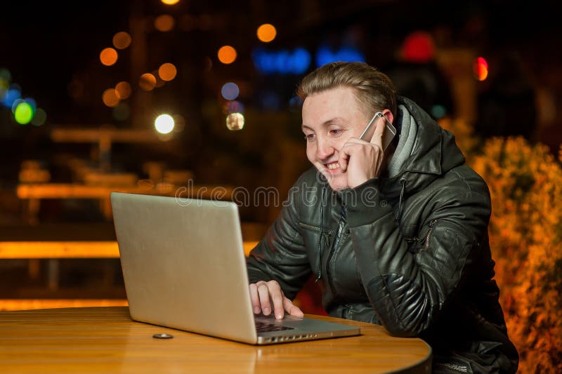 Handsome Young Man with a Computer on the Street Stock Photo - Image of ...