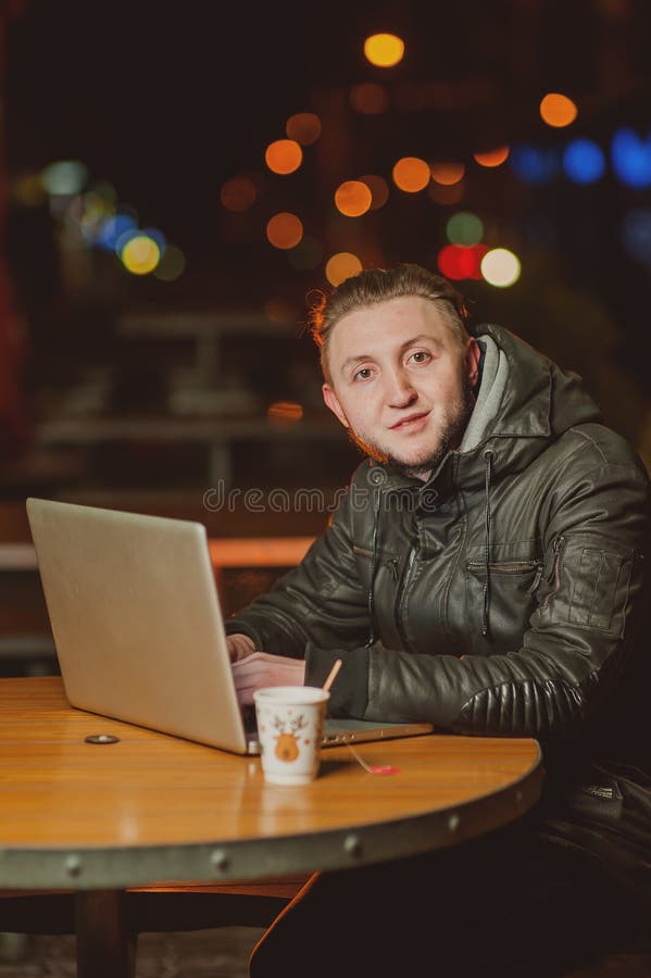 Handsome Young Man with a Computer on the Street Stock Photo - Image of ...
