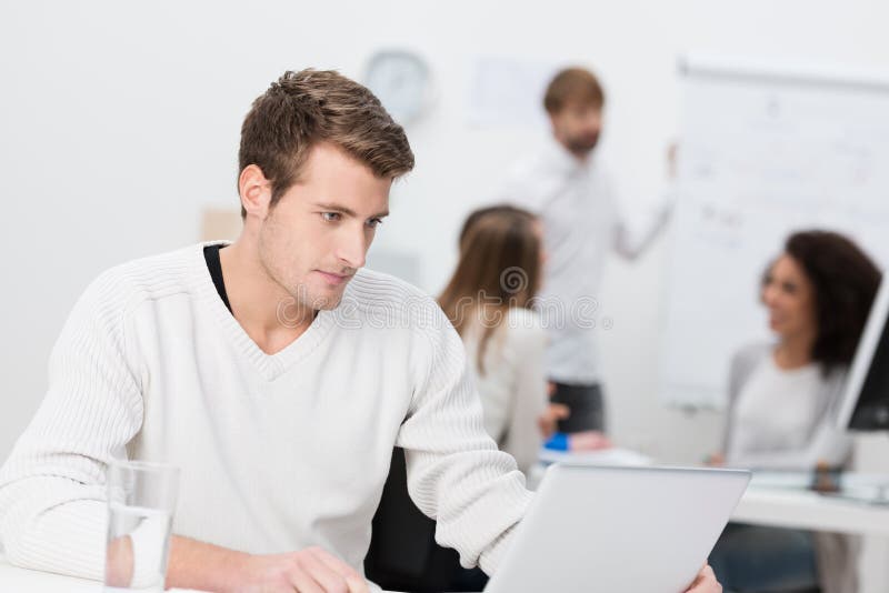 Handsome Young Man Concentrating on His Work Stock Image - Image of ...