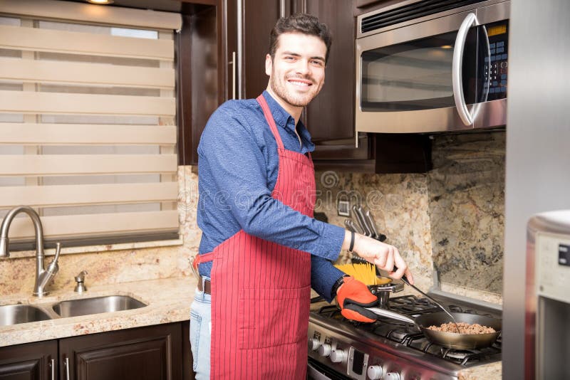 Handsome Young Man Cooking Breakfast at Home Stock Photo - Image of ...