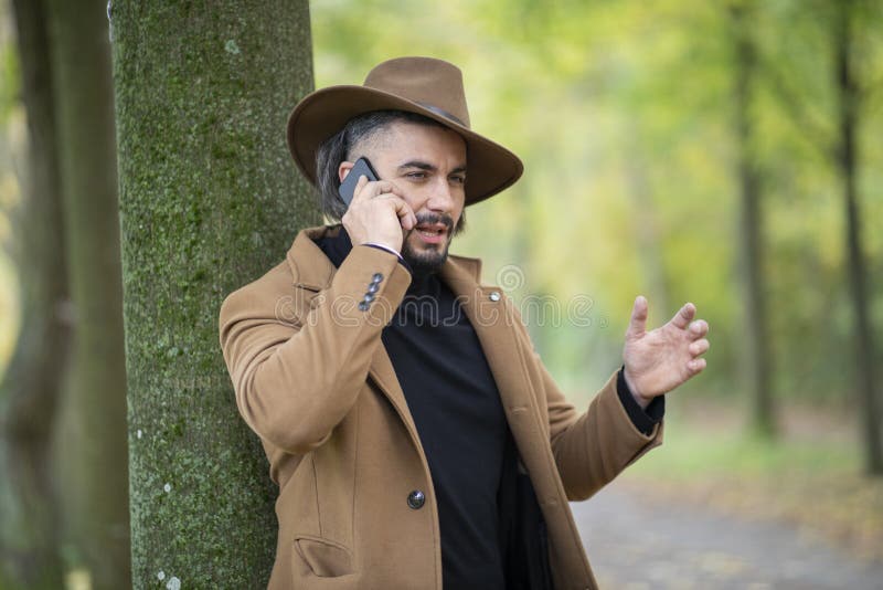 Handsome Young Man with Cowboy Hat Talking on the Phone Stock Image ...