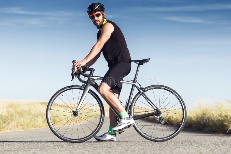 Handsome Young Man Cycling on the Road. Stock Image - Image of bike ...