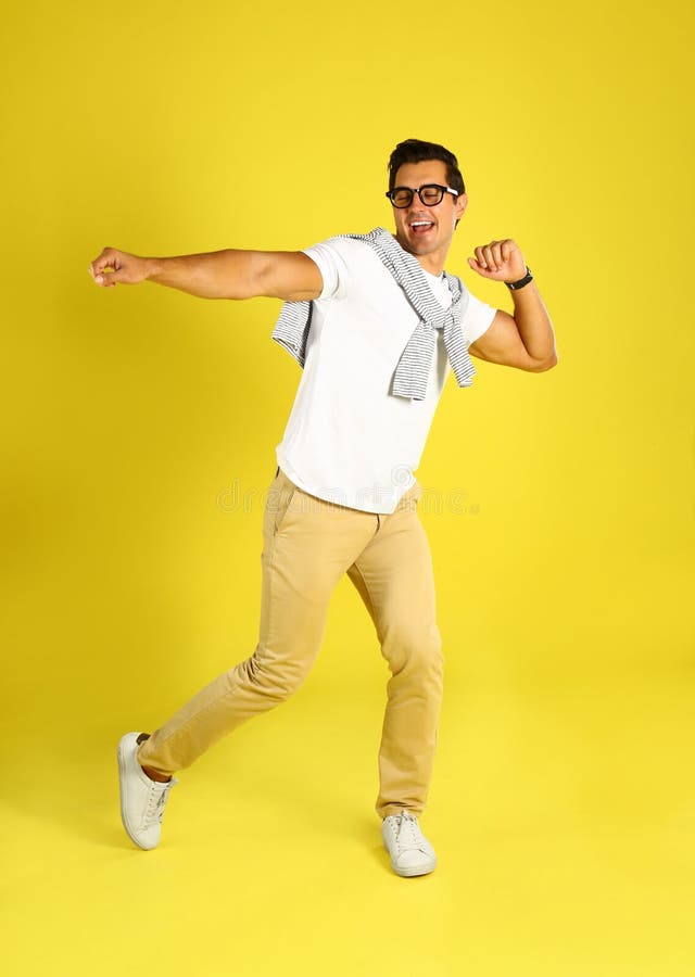 Handsome Young Man Dancing on Yellow Stock Photo - Image of hobby ...