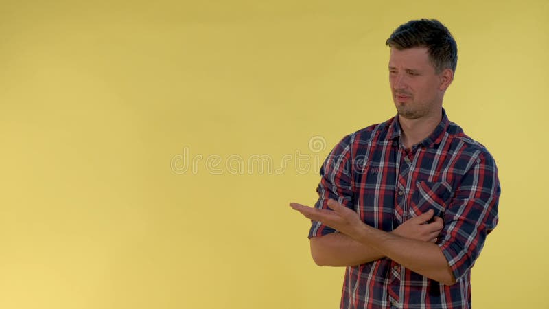 Handsome Young Man Disliking Something and Giving Thumbs Down. Stock ...