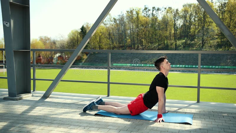 Hamstring Stretch, Young Man is Doing the Exercise by Hamstring Stretch ...