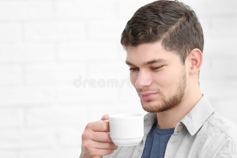 Handsome Young Man Drinking Coffee Stock Photo - Image of lifestyle ... Handsome Young Man Drinking Coffee Stock Photo - Image of lifestyle ...