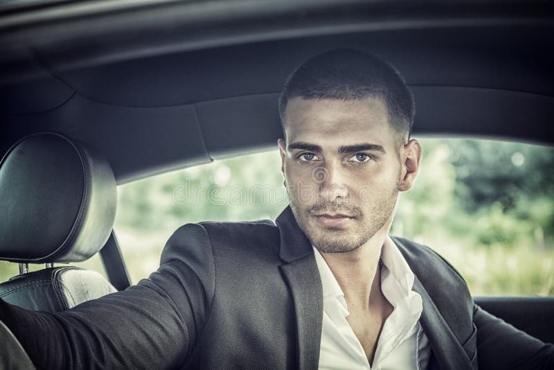 Handsome Young Man Driving a Car Stock Photo - Image of road, front ...