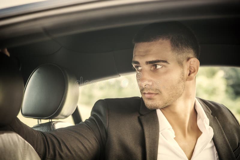 Handsome Young Man Driving a Car Stock Photo - Image of handsome, drive ...
